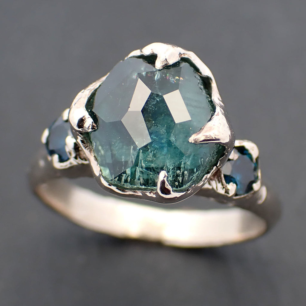 Partially faceted blue Montana Sapphire and fancy cut side sapphires 1 ...